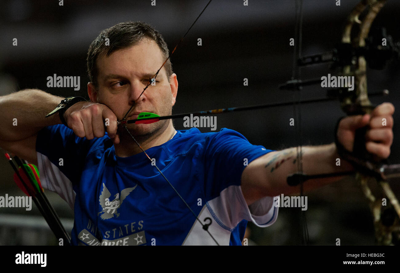 Brian Schaaf, a Warrior Games athlete, pulls back his bow string during ...