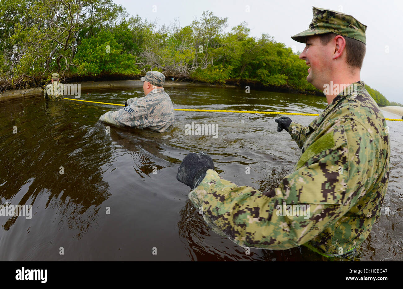Members from the Joint Communications Support Element cross an inlet on ...