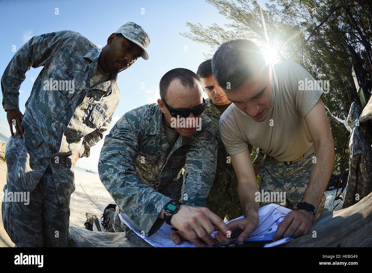 Members of the Joint Communications Support Element assess a map for ...