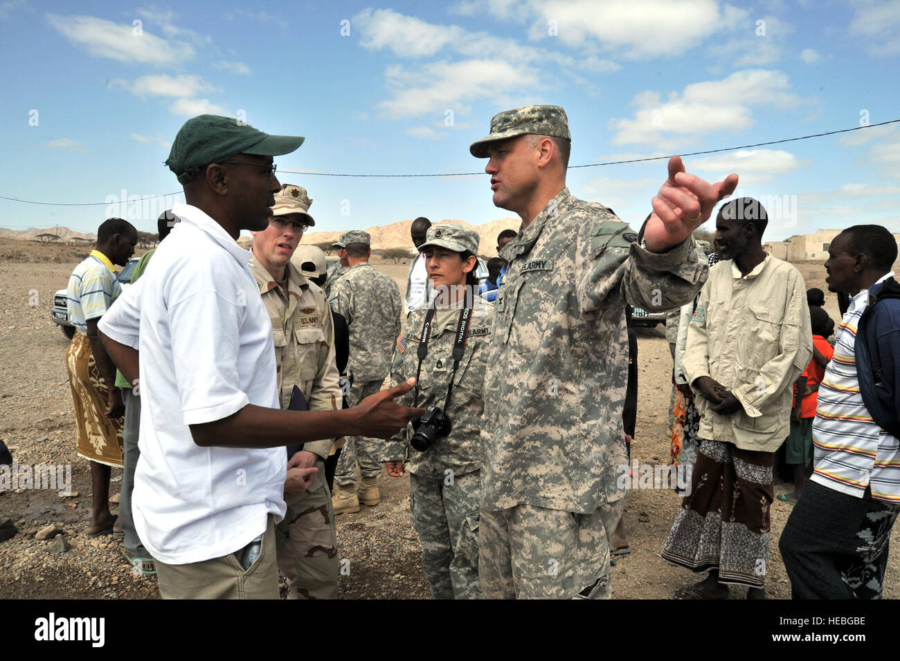 U.S. Army 257th Engineer Team members Aden Hersi (left), translator ...