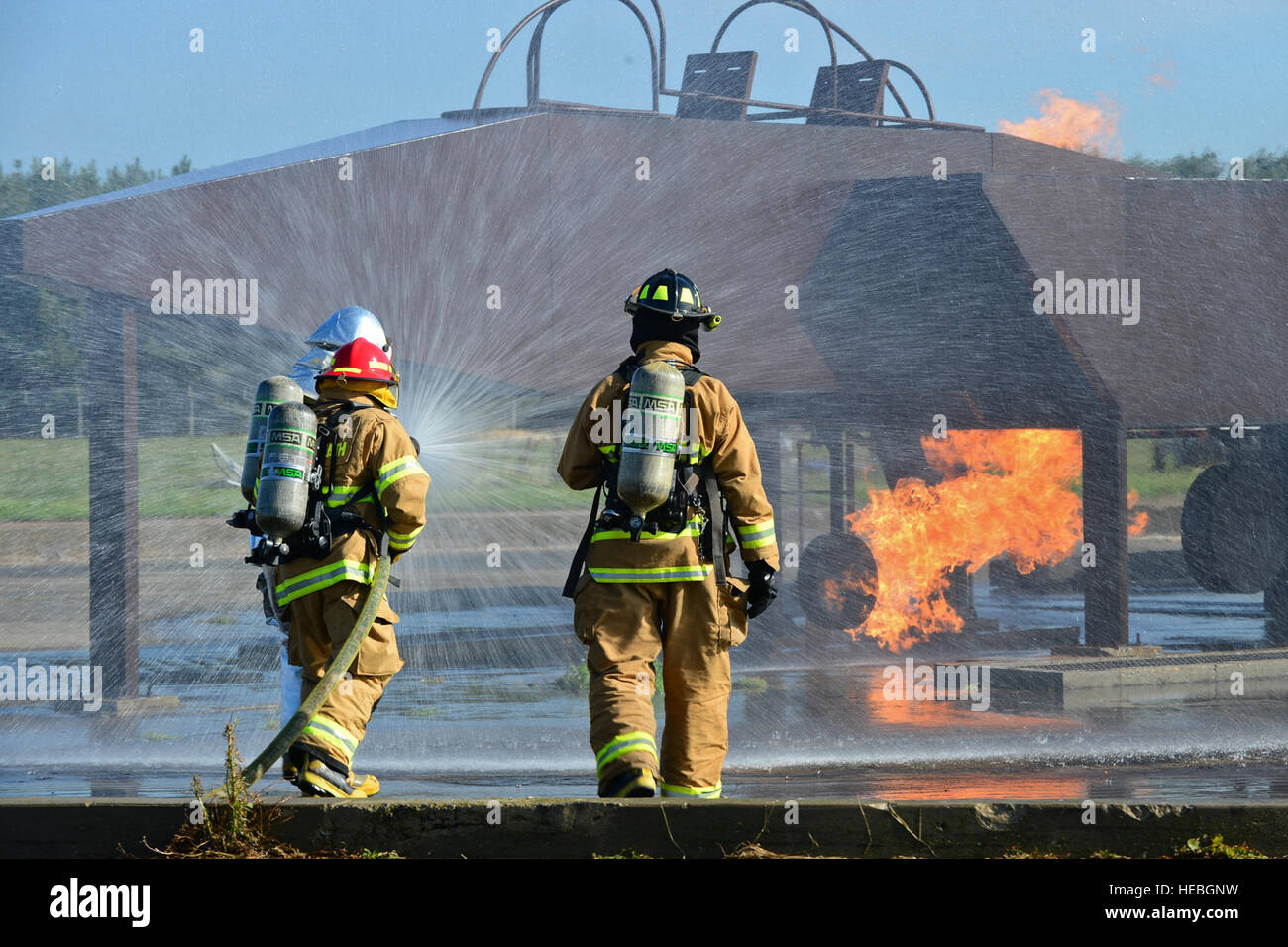 Airmen from the 48th Civil Engineer Squadron Fire Department spray a ...