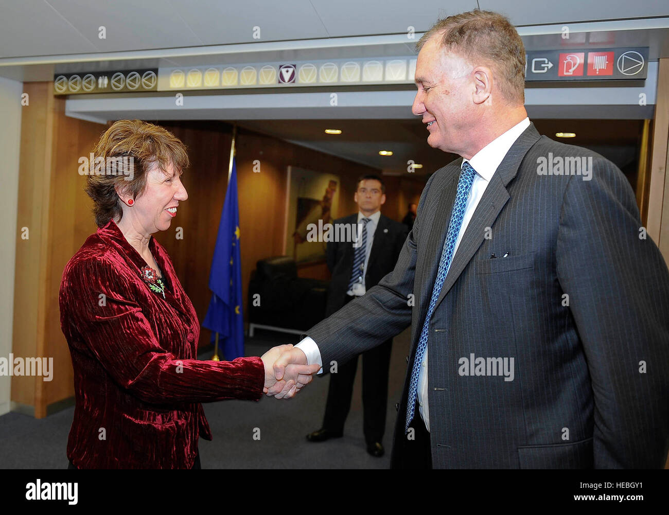 U.S. Deputy Defense Secretary William J. Lynn III shakes hands with ...