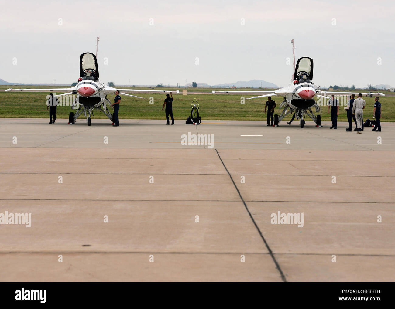 Two U.S. Air Force Thunderbirds receive a postflight inspection on the ...