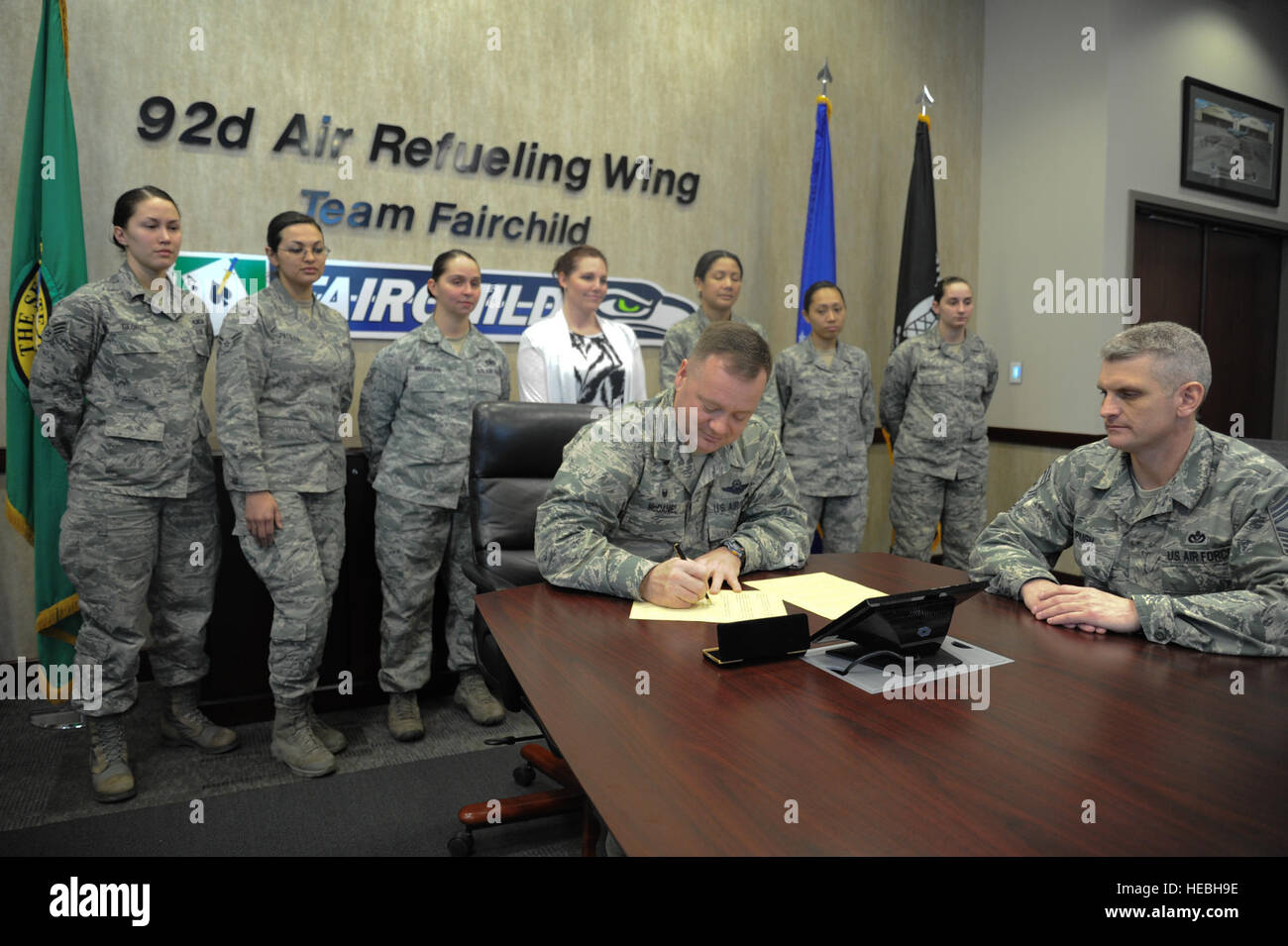 Col. Brian McDaniel, 92nd Air Refueling Wing commander, signs the Women ...