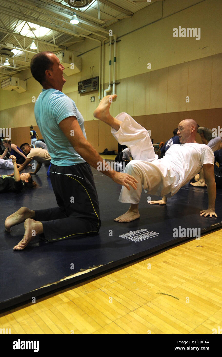 Air Force personnel participate in a self-defense seminar based on ...