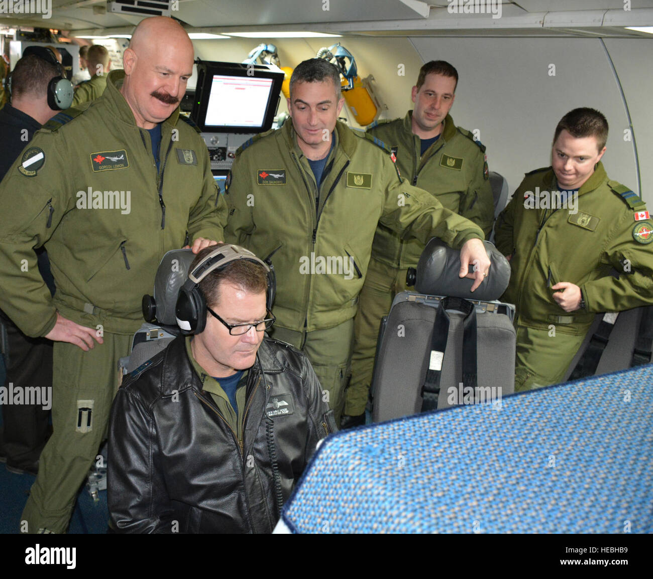 Lt. Gen. Mike Hood, commander of the Royal Canadian Air Force, seated ...