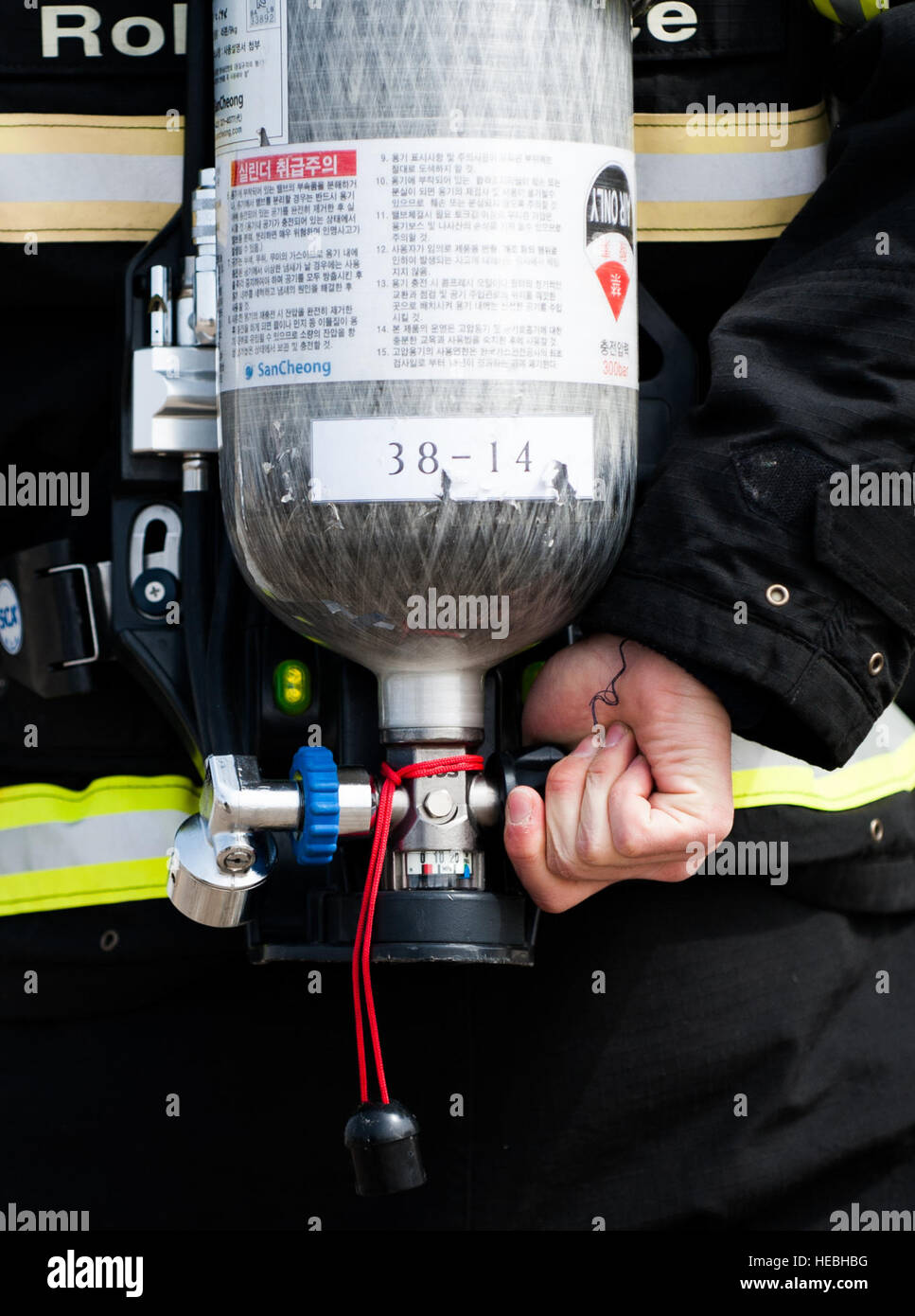A Republic of Korea air force 38th Fighter Group firefighter adjusts ...
