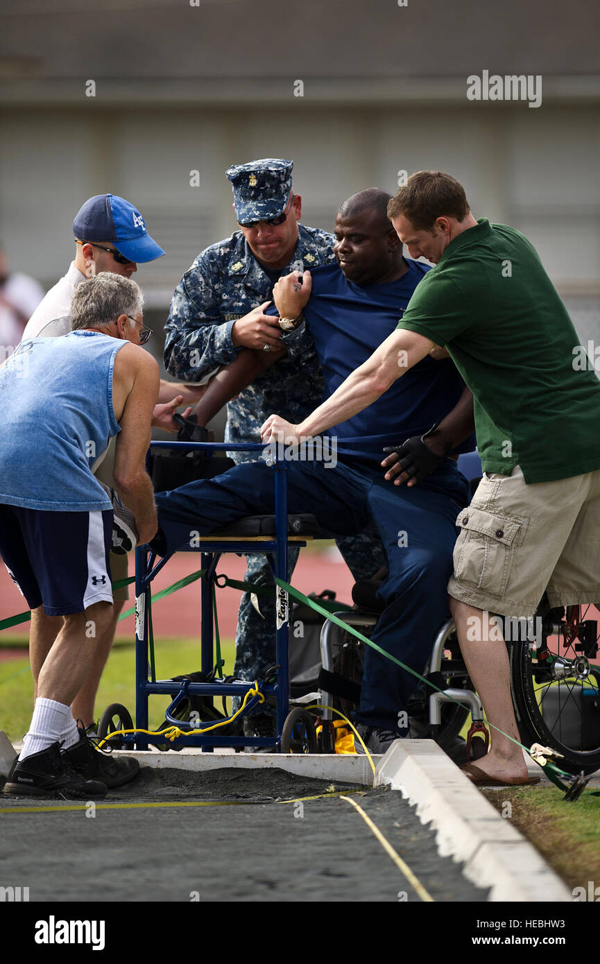 Volunteers with the Navy Wounded Warrior Safe Harbor assist Retired U.S ...