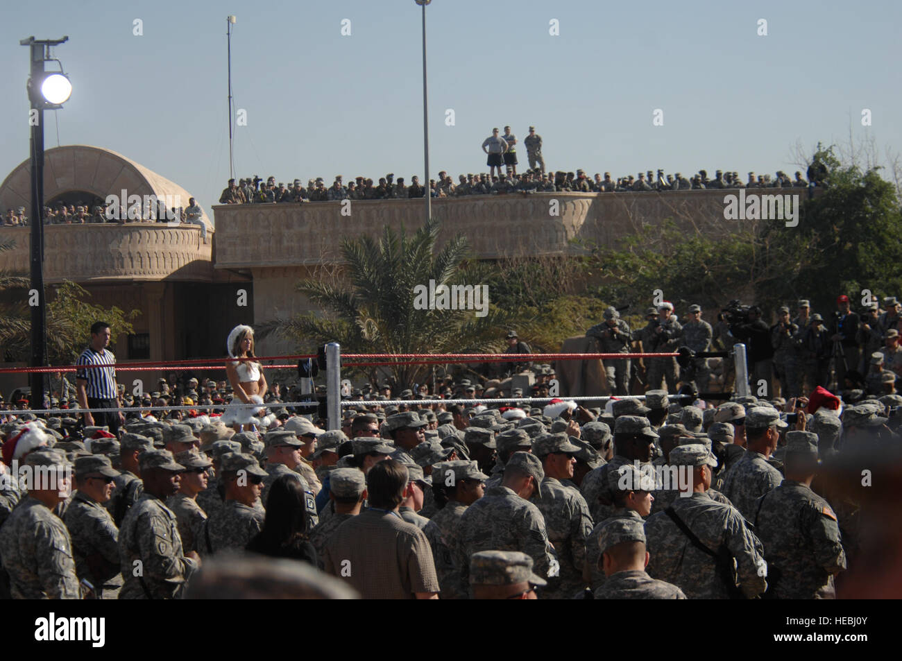 U.S. Soldiers await the start of the World Wrestling Entertainment show ...
