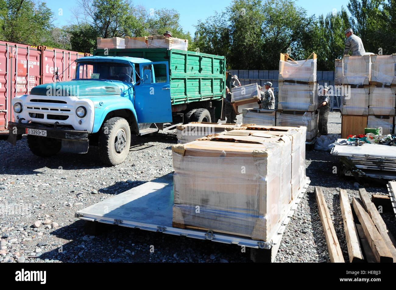 TRANSIT CENTER AT MANAS, Kyrgyzstan -- Desks are loaded onto trucks to ...
