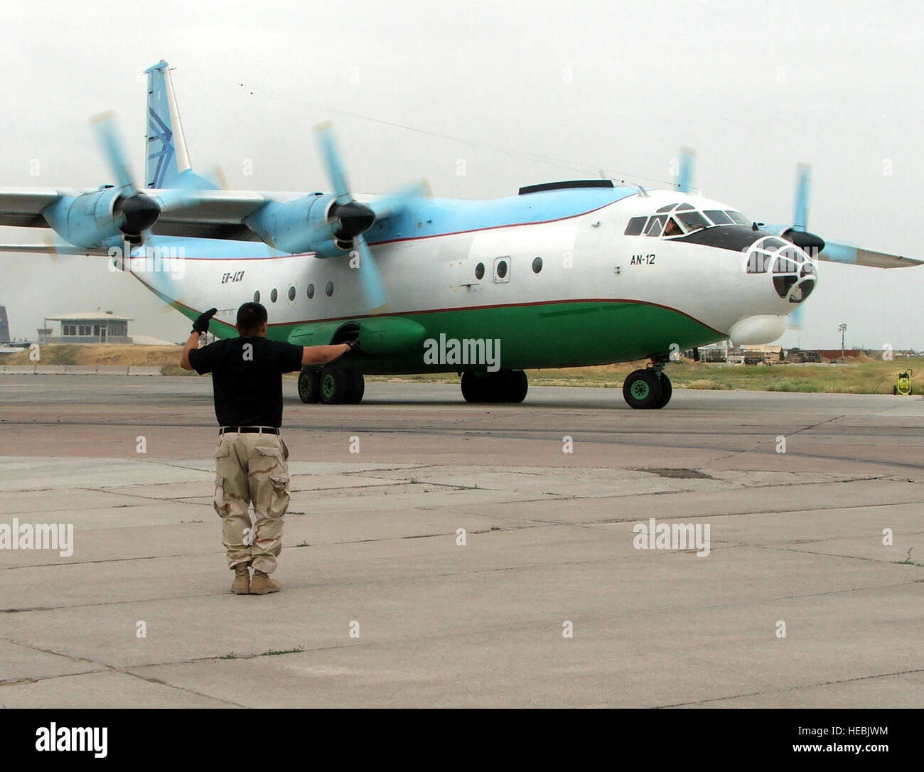 A 60th Air Mobility Wing Airman at Travis Air Force Base marshals a ...