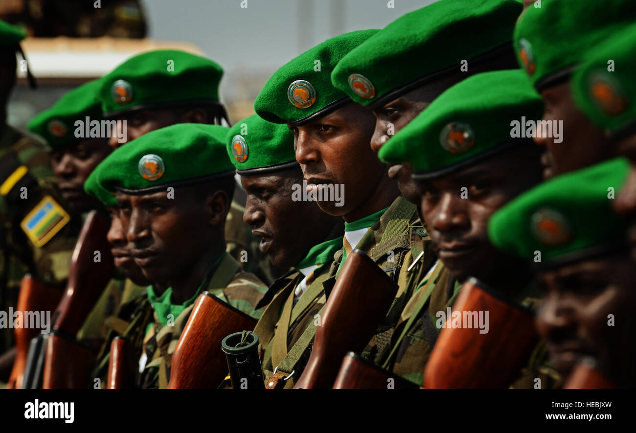 Rwandan soldiers stand in formation awaiting orders after being dropped ...