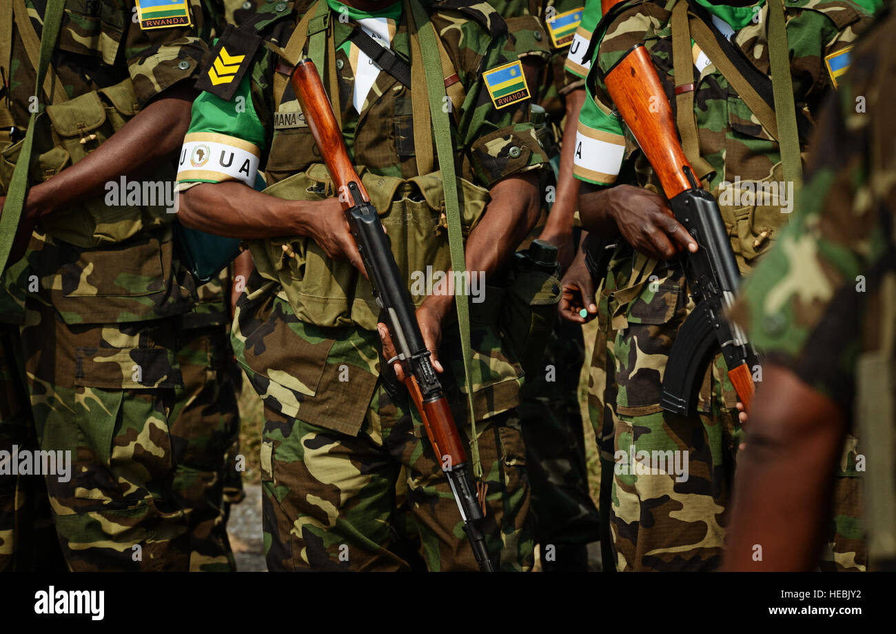 Rwandan soldiers stand in formation awaiting orders after being dropped ...
