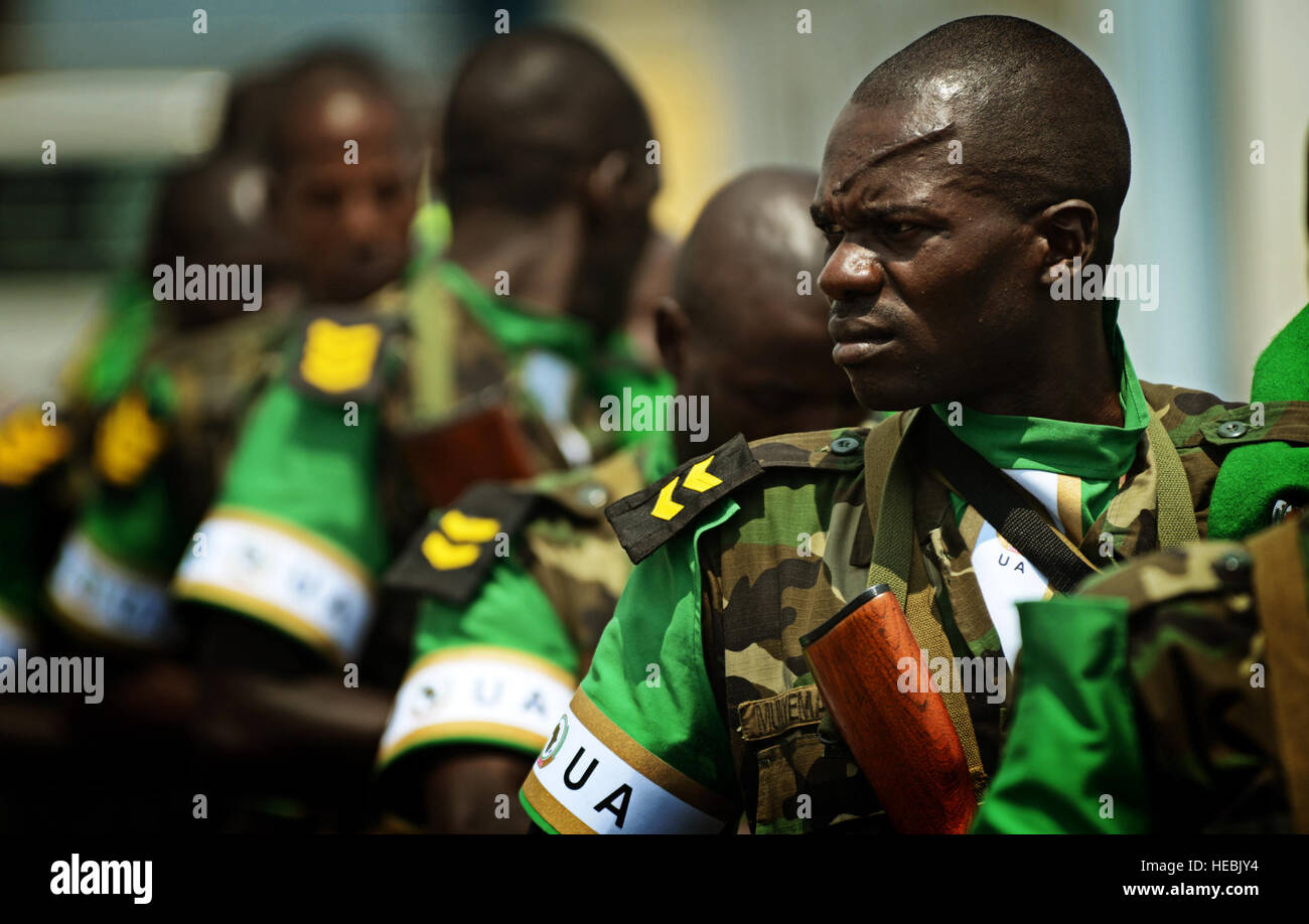 Rwandan soldiers wait in line to board a U.S. Air Force C-17 ...