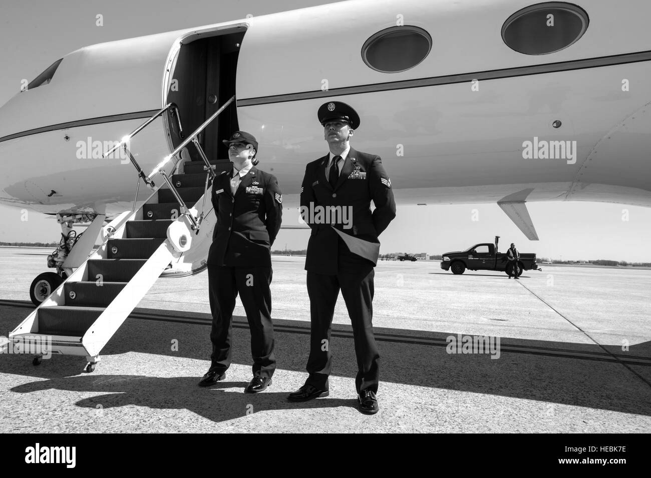 Airmen from the 89th Aerial Port Squadron stand at parade rest beside a ...