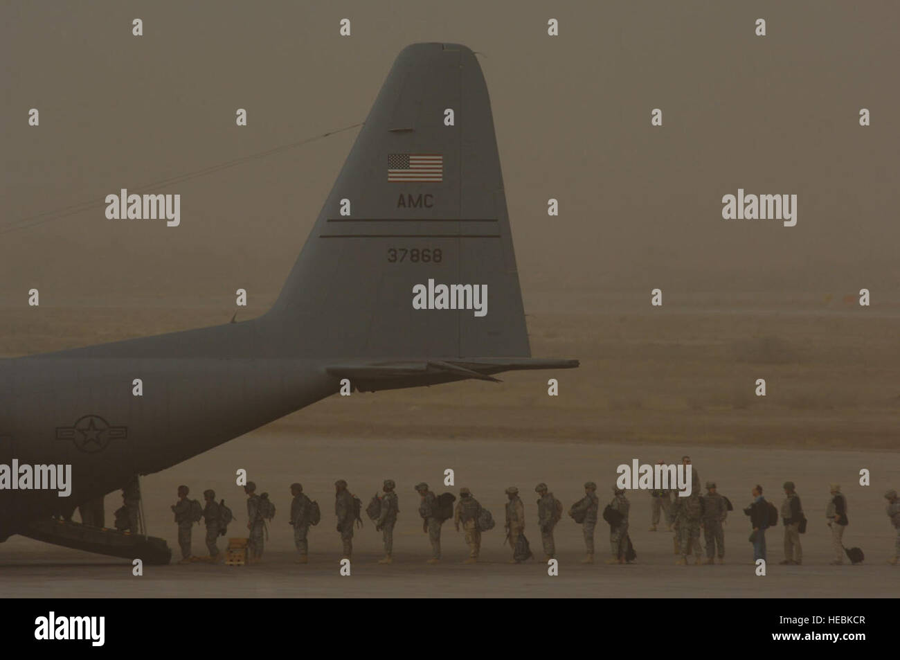 Personnel supporting Operation Iraqi Freedom load on to a C-130 ...