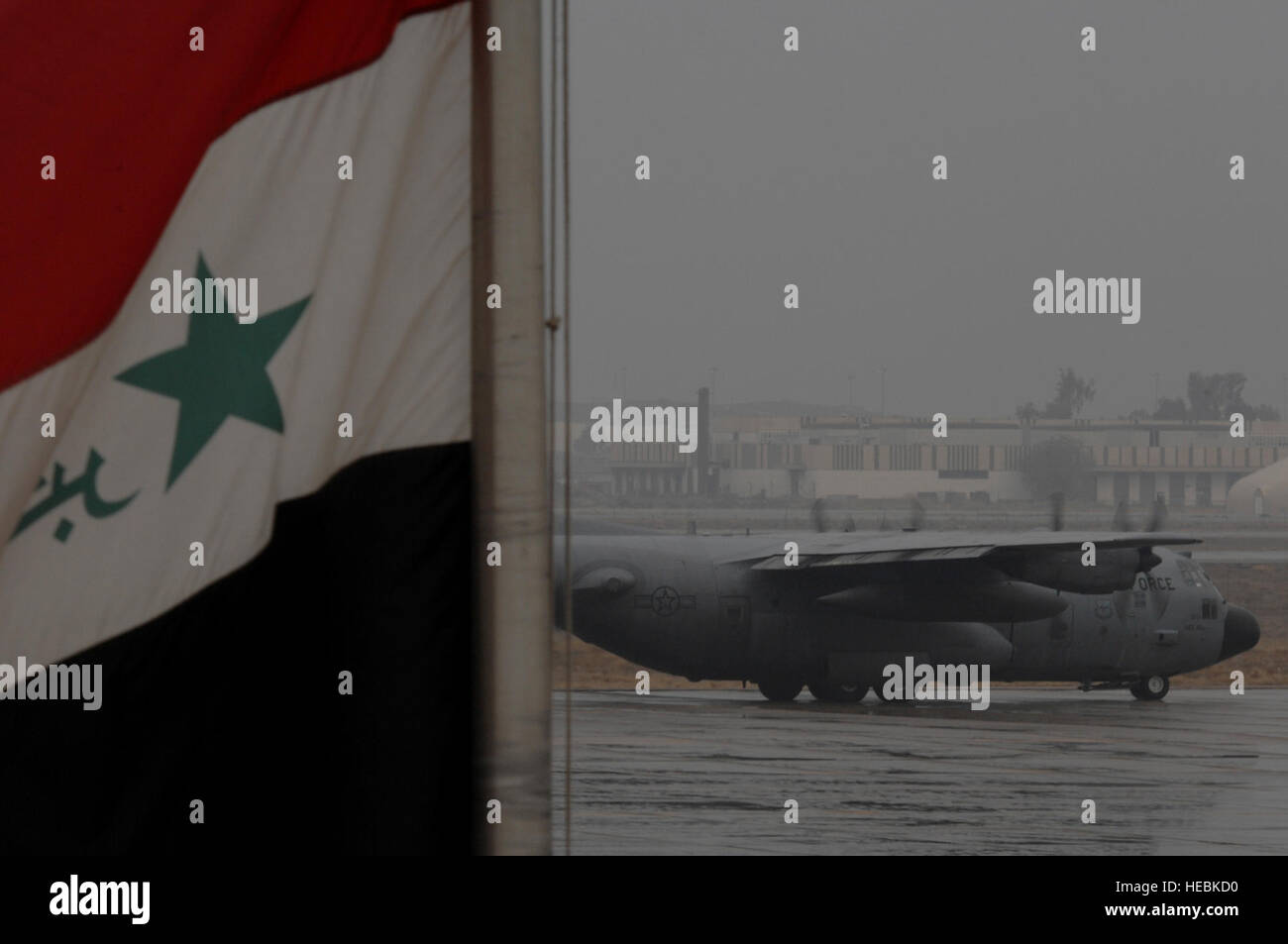 A Little Rock Air Force Base C-130 Hercules taxis through the rain ...