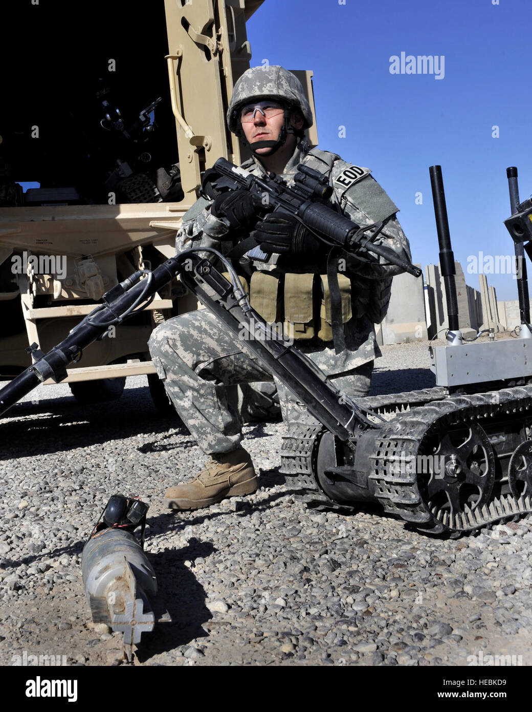 Tech. Sgt Jeffrey Wasik kneels next to an explosive ordnance disposal ...