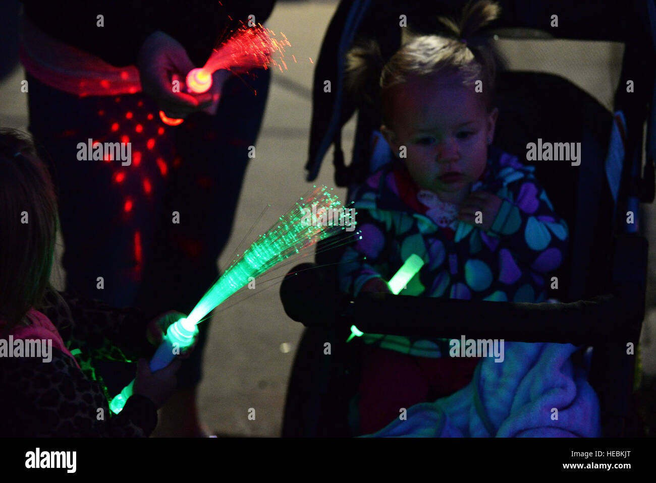 A family uses some of the glow gear they received for a Take Back the ...