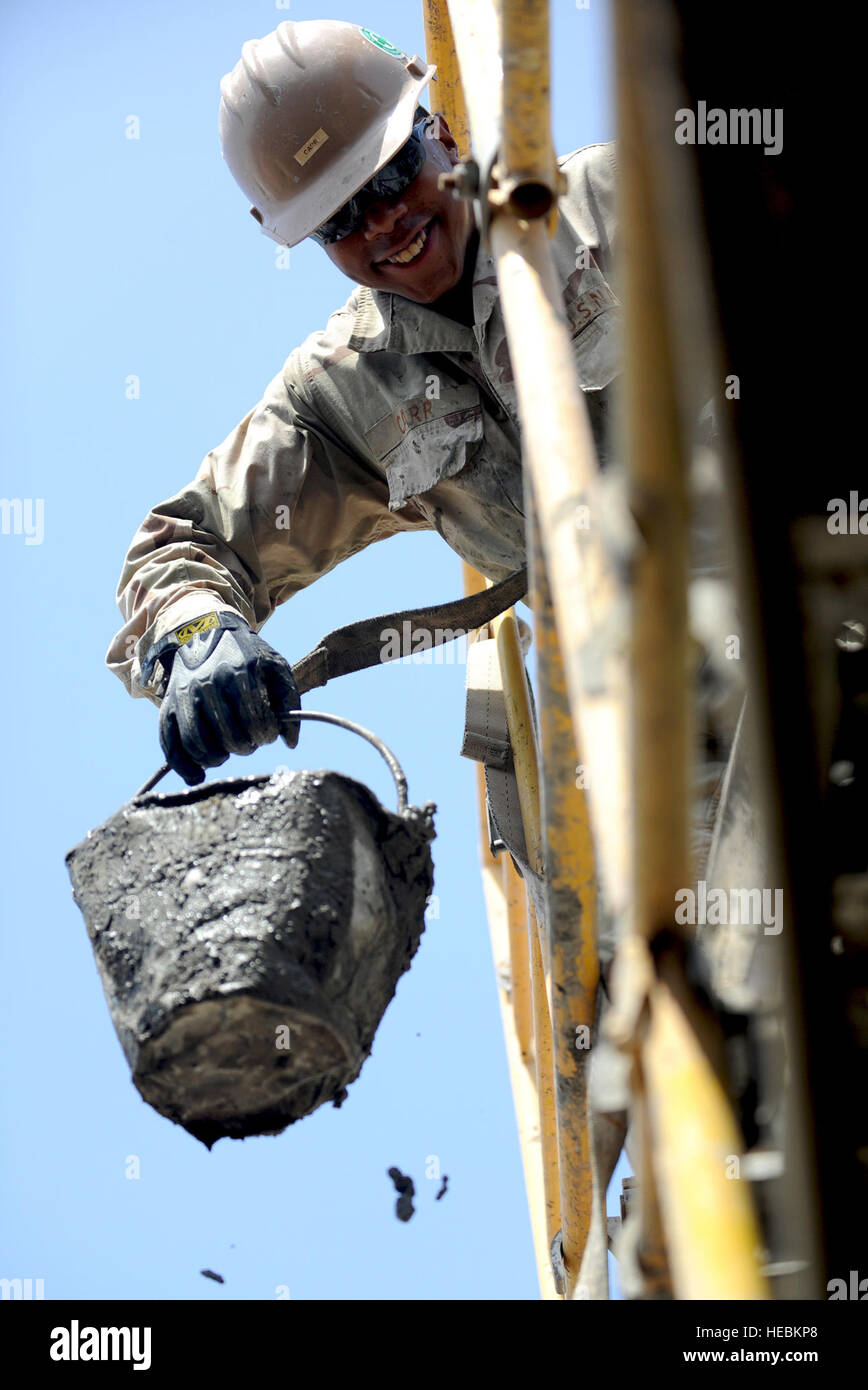 U. S. Navy Seaman Victor Carr, a Seabee assigned to Naval Mobile ...