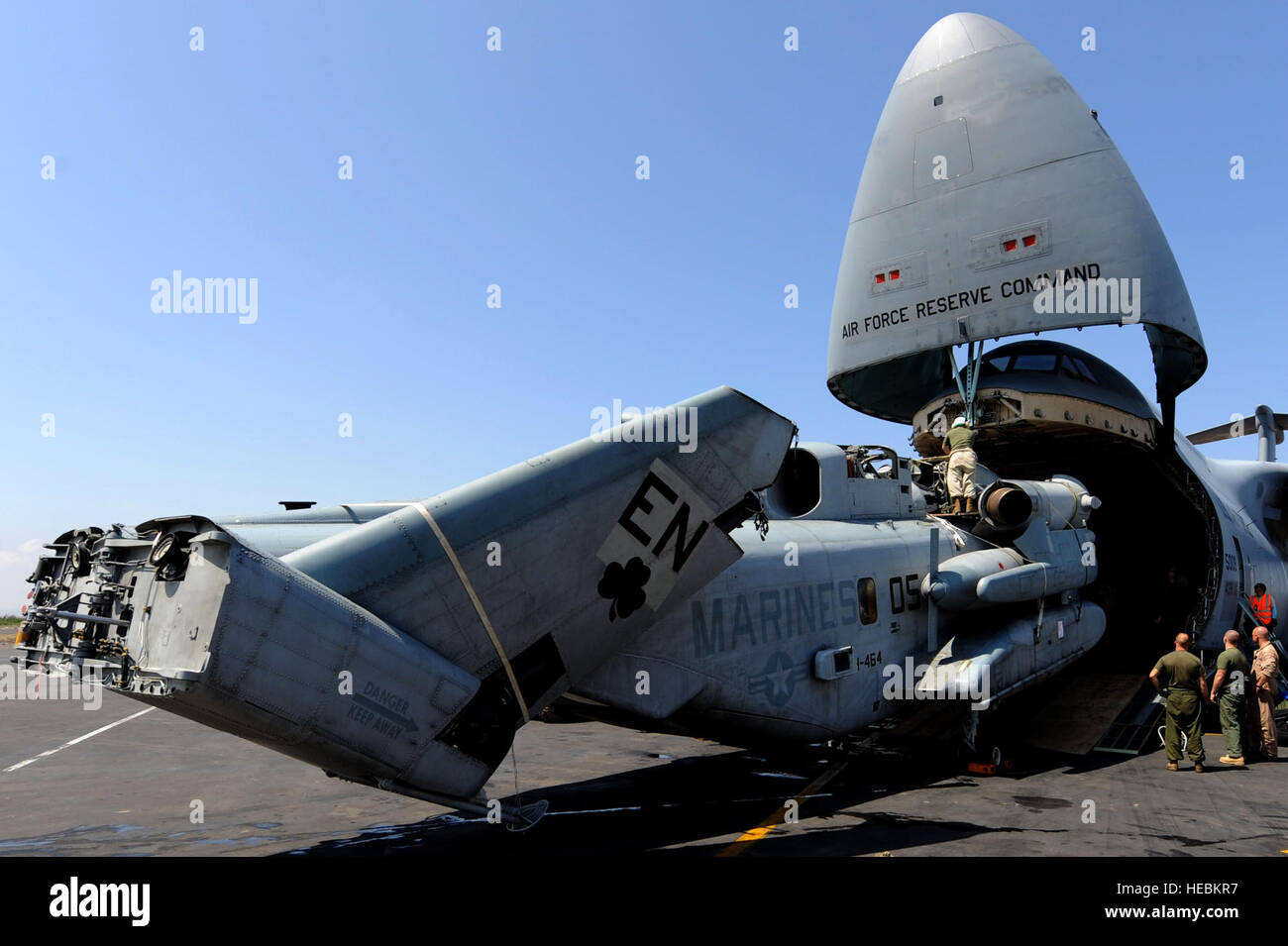 U.S. Marines load a CH-53 helicopter onto a U.S. Air Force C-5 on Camp ...