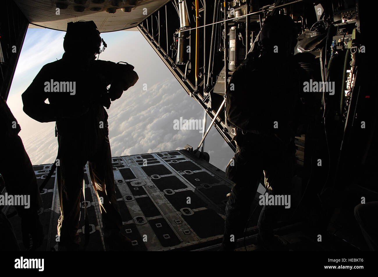 Loadmaster Senior Airman Daniel Sullivan and a pararescueman prepare ...
