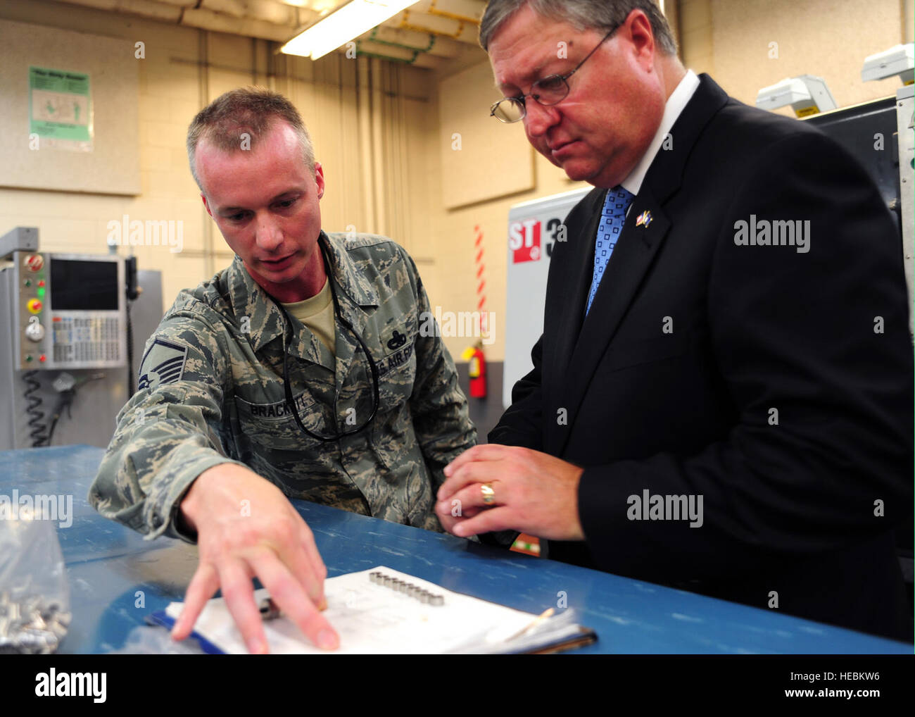 Master Sgt. Kevin Brackett shows Secretary of the Air Force Michael ...