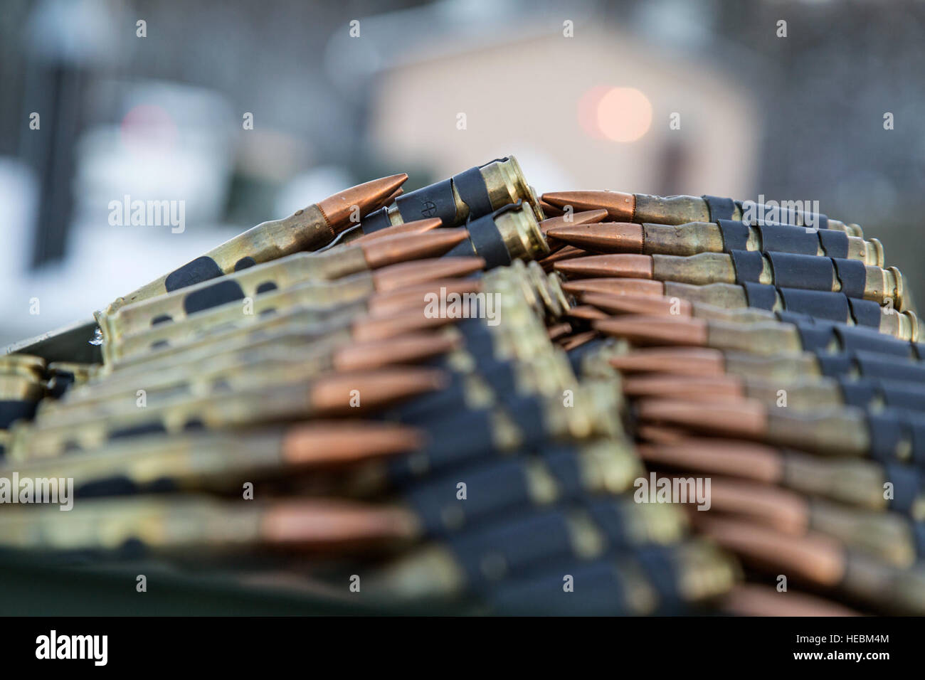 Strips of 7.62x51mm ball ammunition are staged for M240B machine gun ...