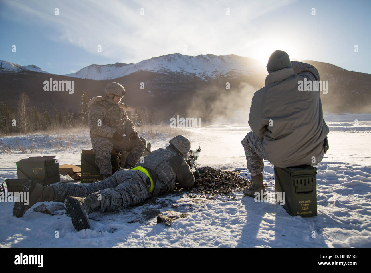 Airmen assigned to the 673rd Security Forces Squadron operate and fire ...