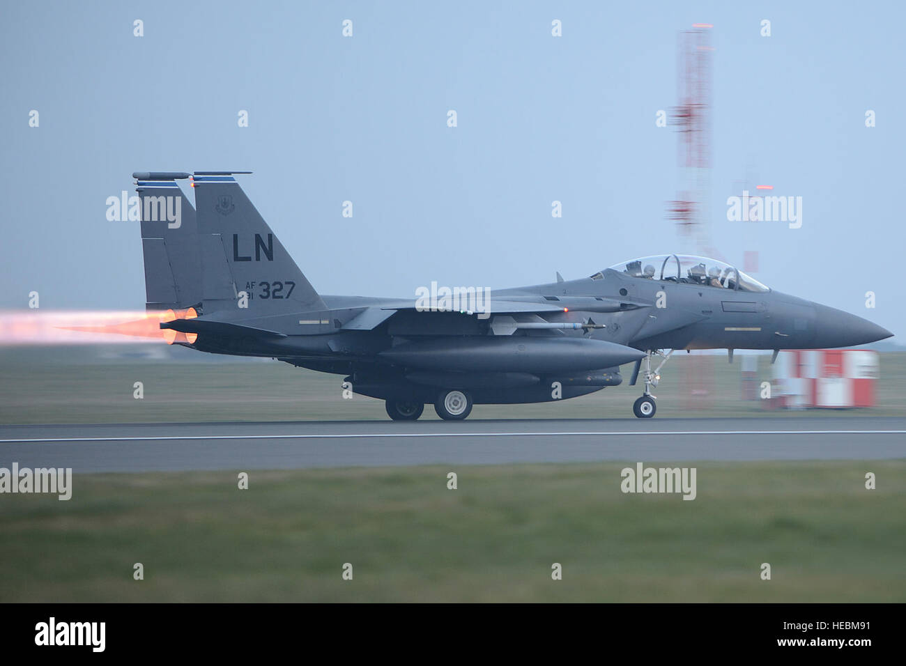An F-15E Strike Eagle takes off from the flightline April 1, 2014, at Royal Air Force Lakenheath ...
