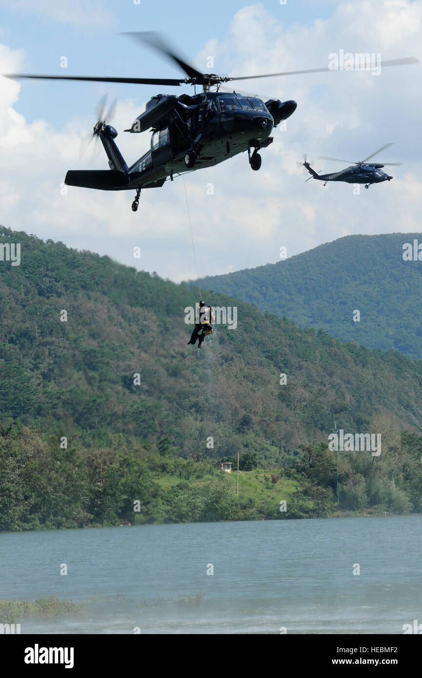 A South Korean air force rescue team lifts Lt. Col. Jeremy Quatacker ...