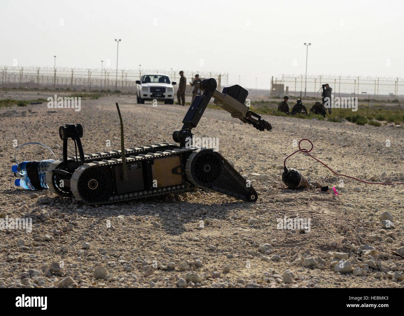 A Packbot 310 robot engages an improvised explosive device during a ...
