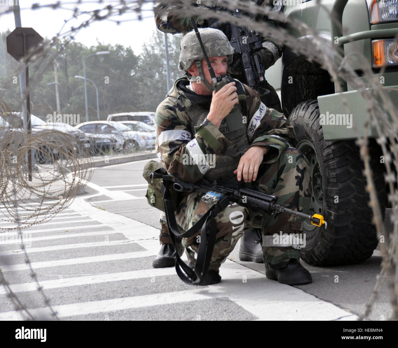 Tech. Sgt. James Nephew, 51st Security Forces Squadron member, radios ...