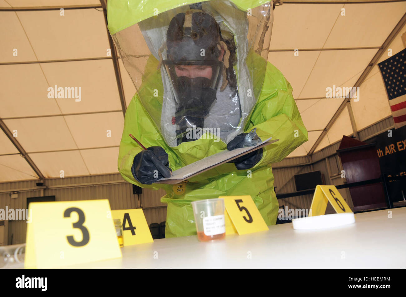An emergency management Airman from the 380th Expeditionary Civil ...