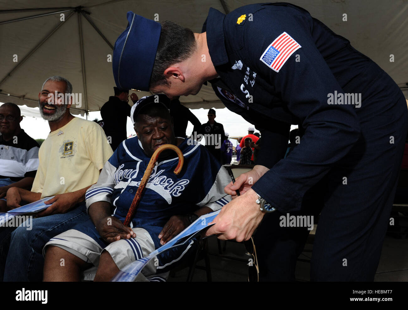 A Thunderbird 5 Lead Solo pilot interacts with local community members ...