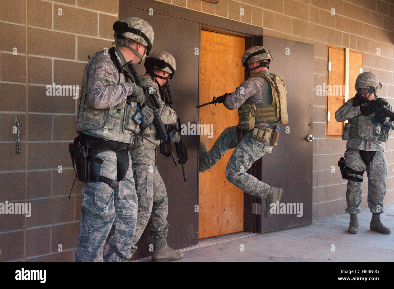 Guardsmen of the 124th Security Forces Squadron prepare to make entry ...