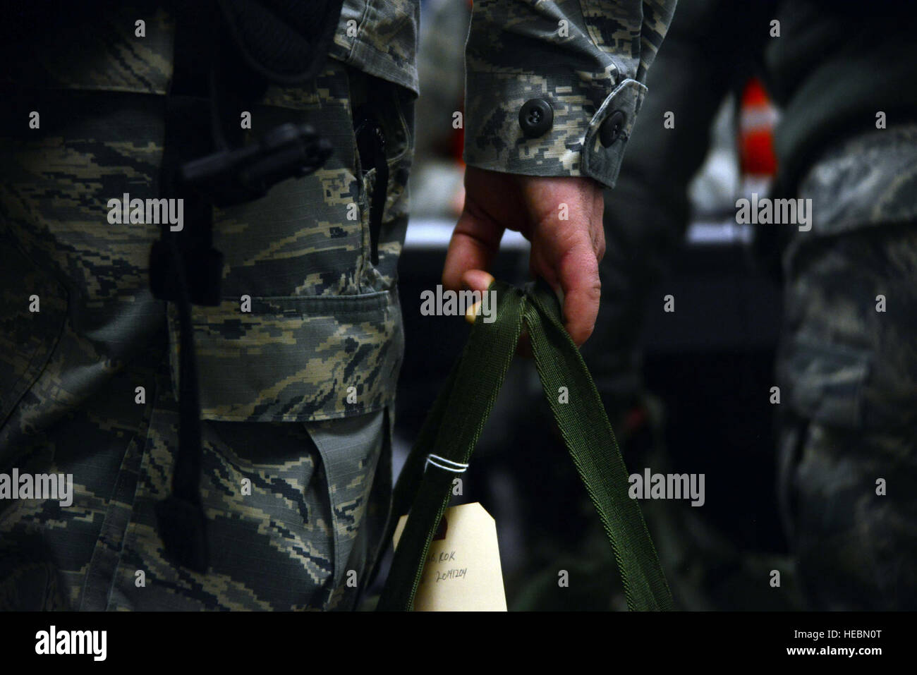 An Airman from the 35th Fighter Wing stands in a personnel deployment ...