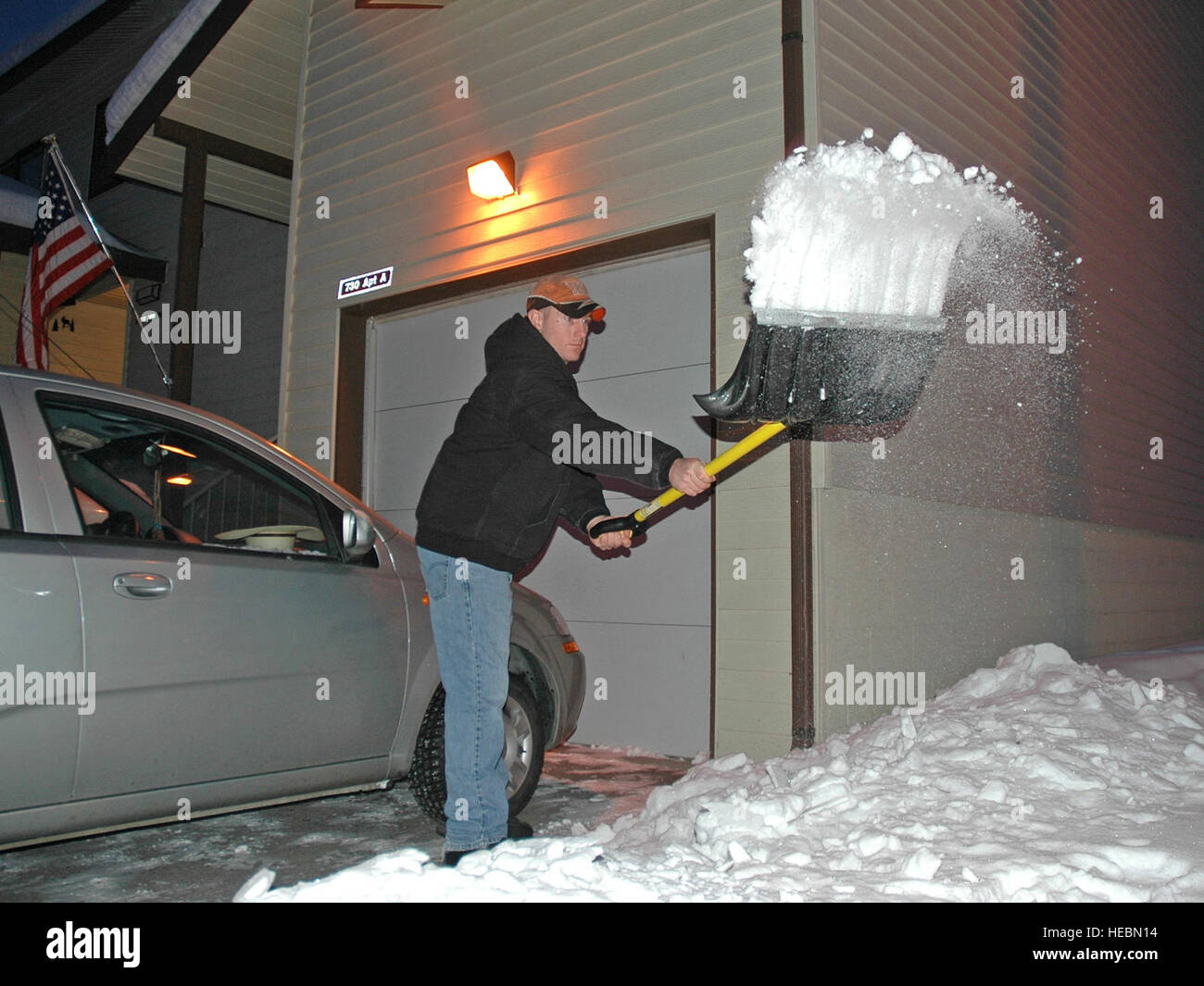 Staff Sgt. Phillip Bridges, 354th Logistics Readiness Squadron, shovels ...