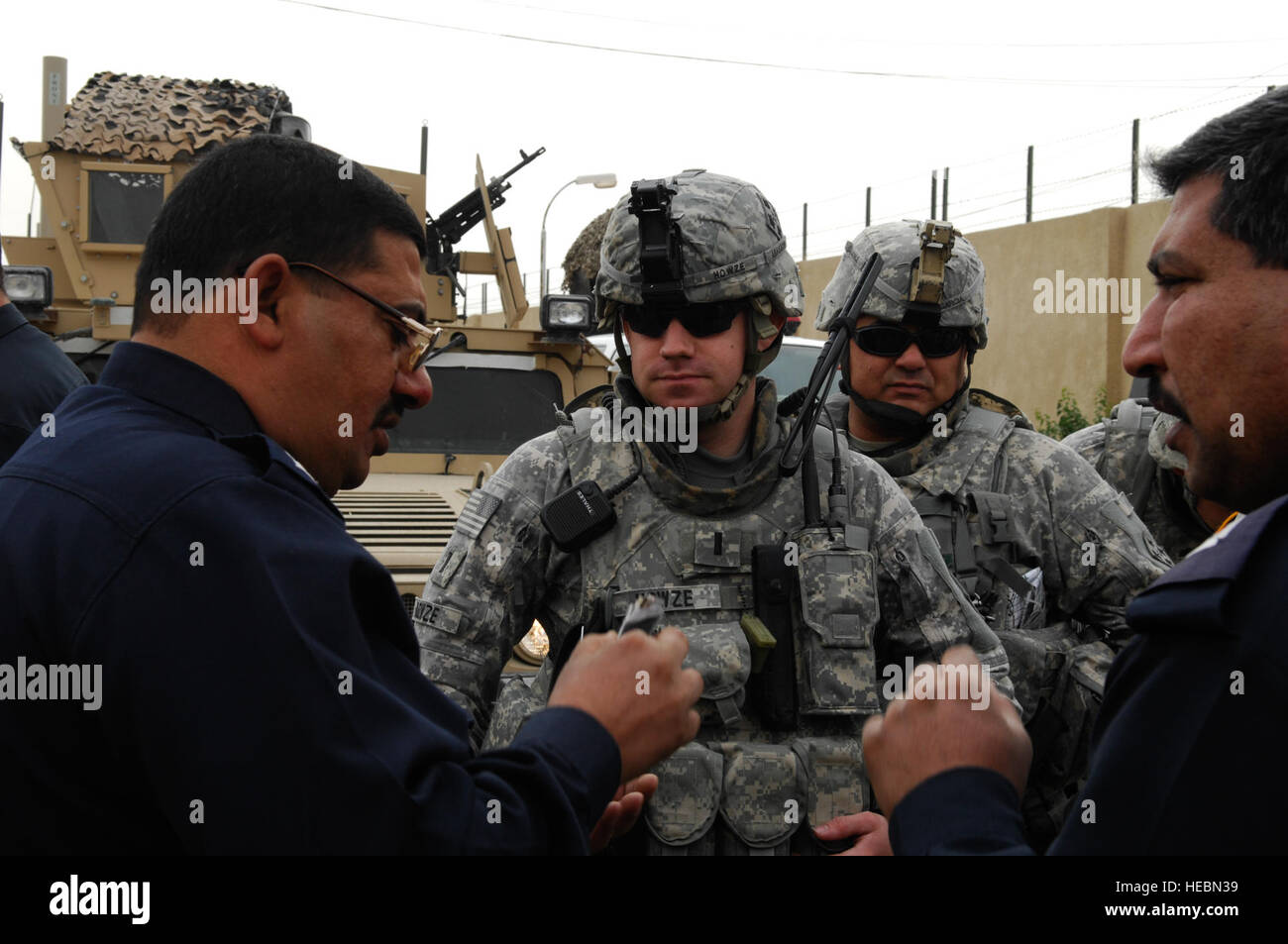 U.S. Soldiers 1st Lt. Sean Howze and Sgt. 1st Class Hiram Garcia for ...