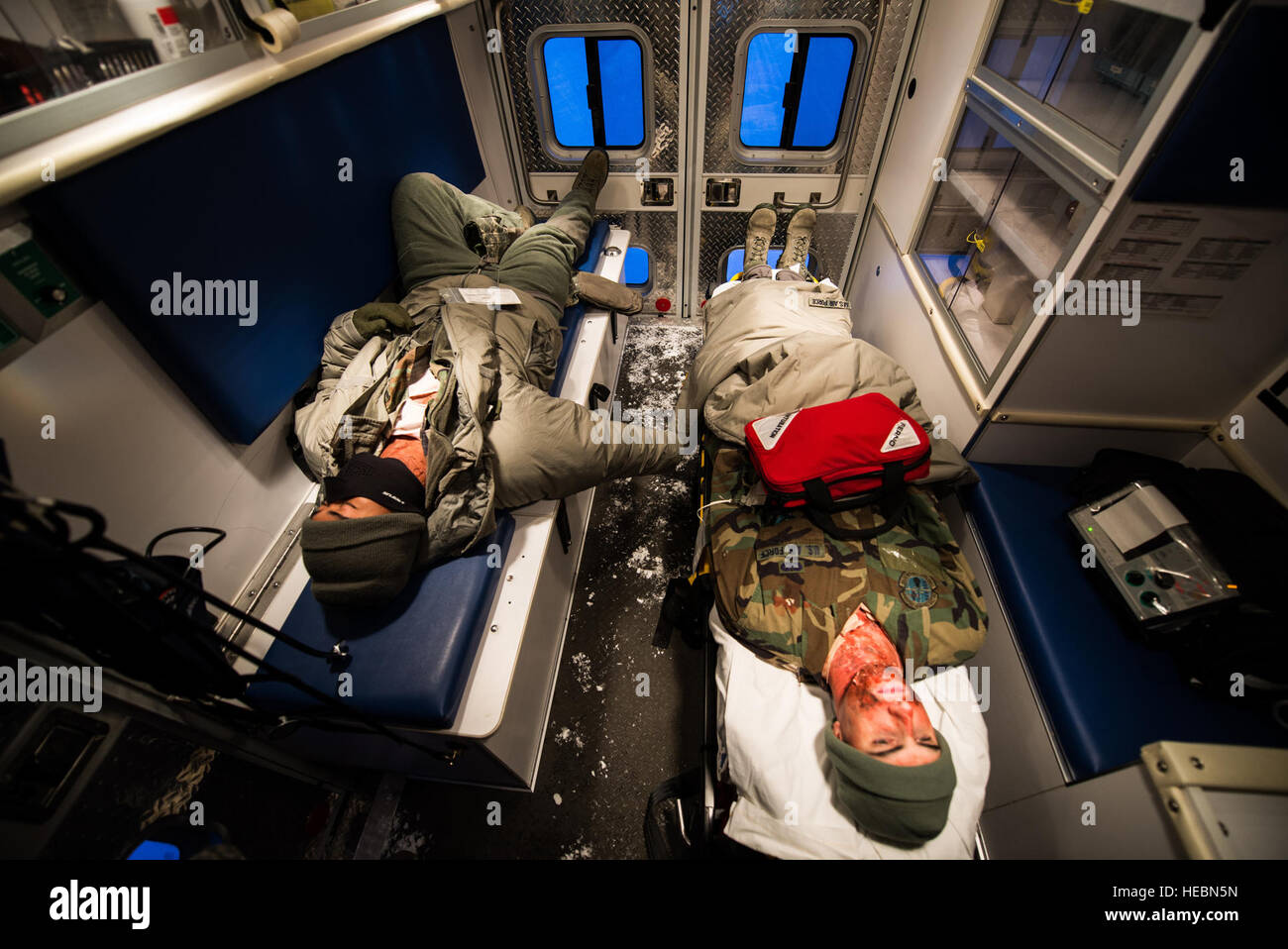 Simulated casualties are transported in an ambulance during a major ...