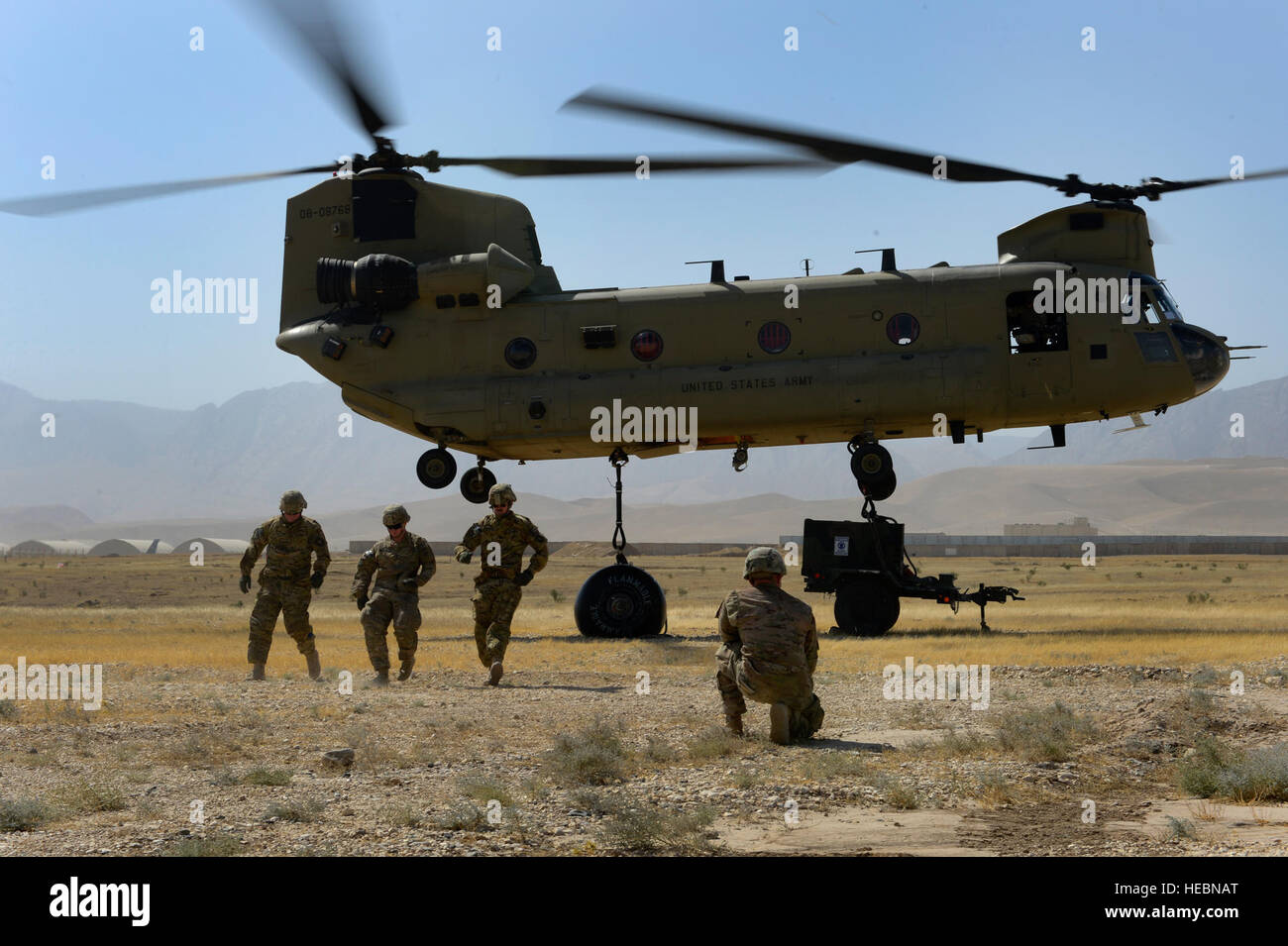 U.S. Soldiers, assigned to the 1569th Transportation Company, clear a ...
