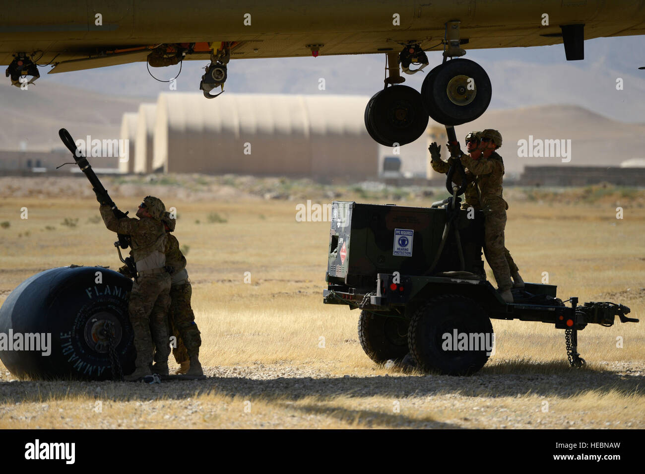 U.S. Soldiers, assigned to the 1569th Transportation Company, attach a ...