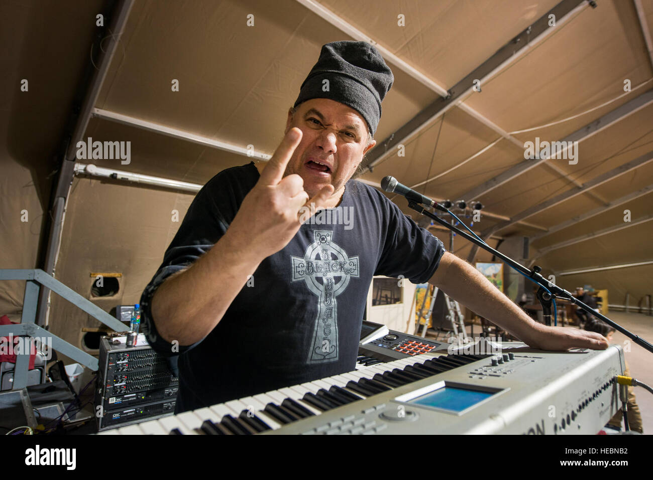 Paul Mowris, keyboardist, displays the universal sign for rock'n'roll ...