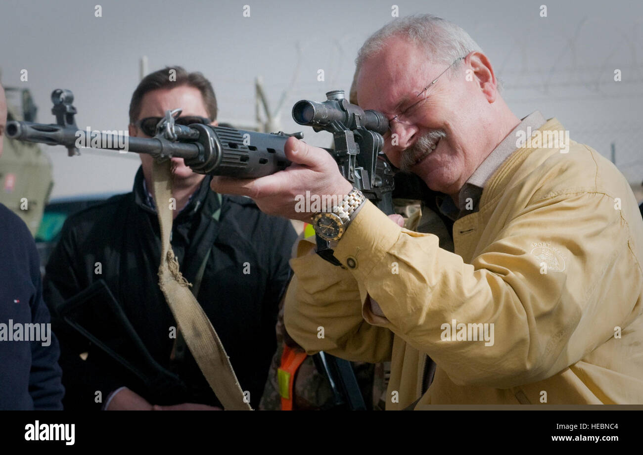 Slovak President Ivan Gasparovic looks through the scope of a Dragunov ...