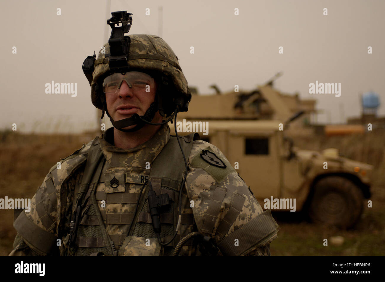 U.S. Army Staff Sgt. Kevin Rettig, monitors the radios while other ...