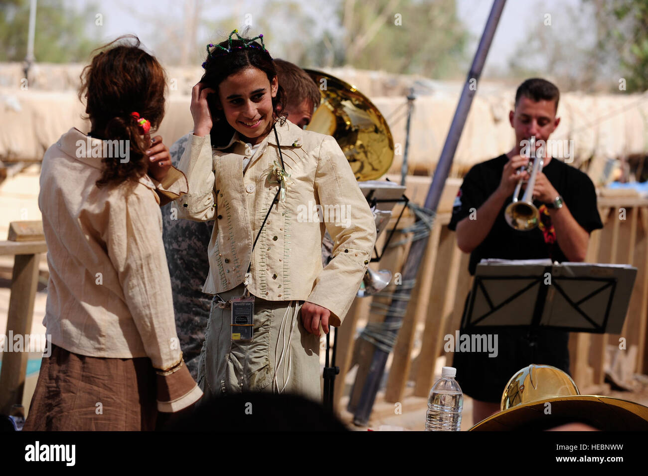 Iraqi girls dance as they enjoy music from the band during the ...