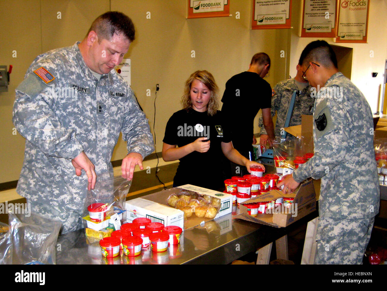 U.S. Army soldiers, including new recruits, pack food backpacks for ...