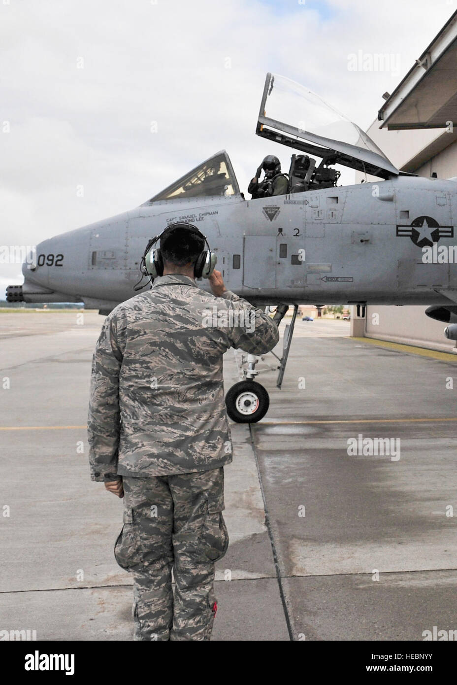 Capt. Robert Carpenter and Senior Airman Michael Stedman salute each ...