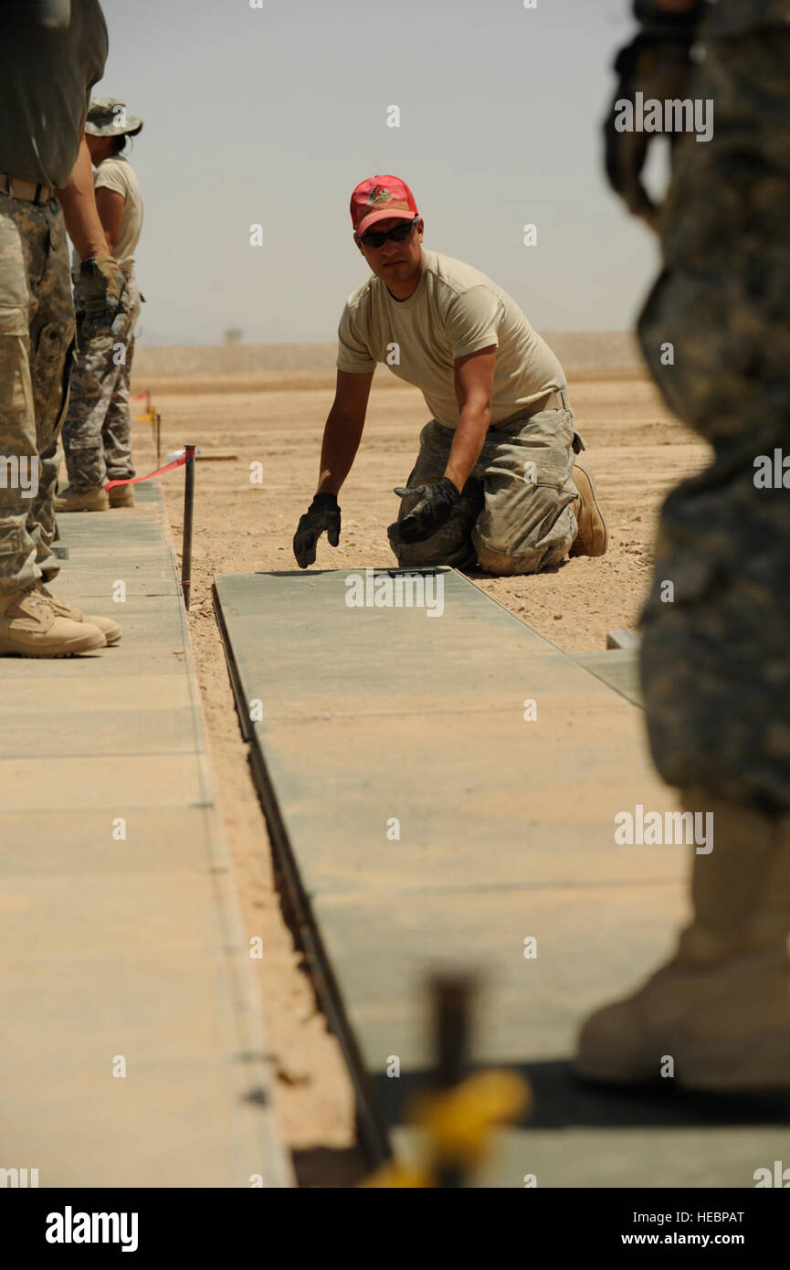 U.S. Air Force Staff Sgt. Michael Zamora (left), civil engineer ...