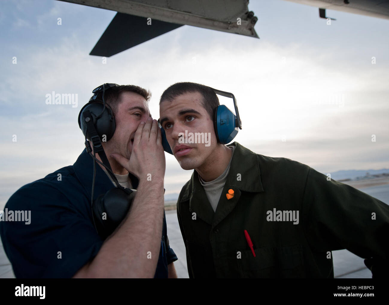 Airman 1st Class Gabriel Henry yells to Airman 1st Class Brian Allen ...
